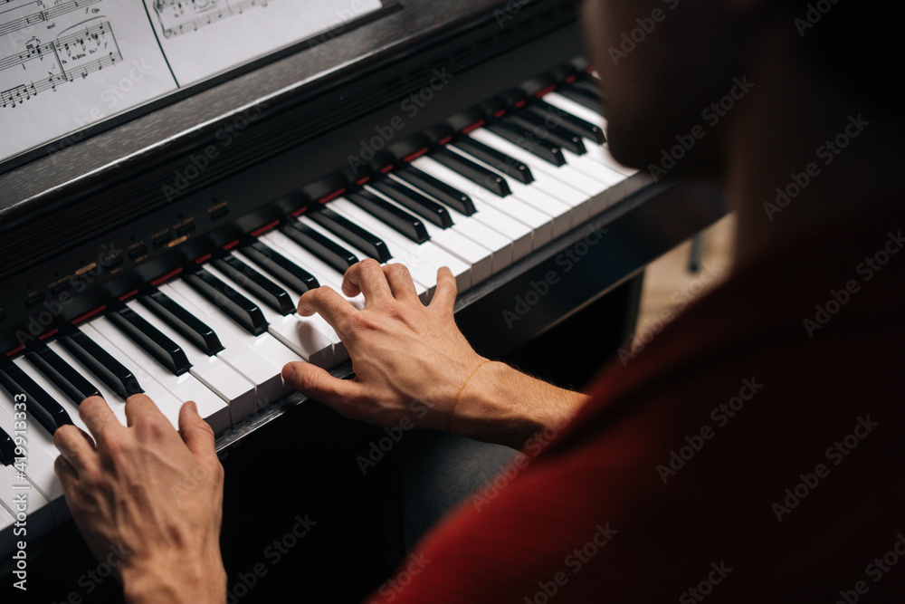 Person Playing Piano Back View