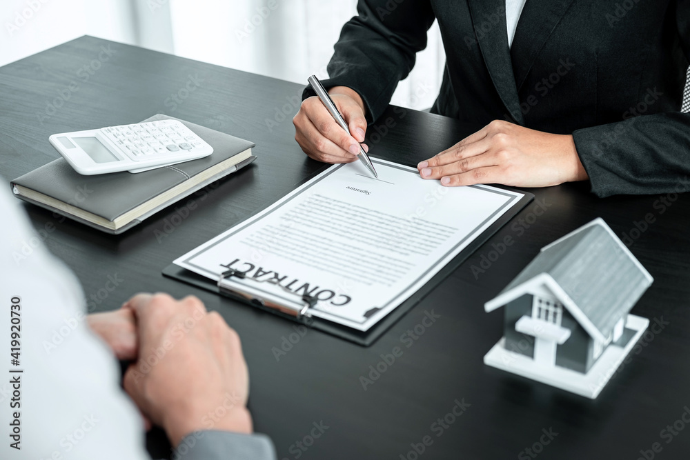 Real estate agent working sign agreement document contract for home ...