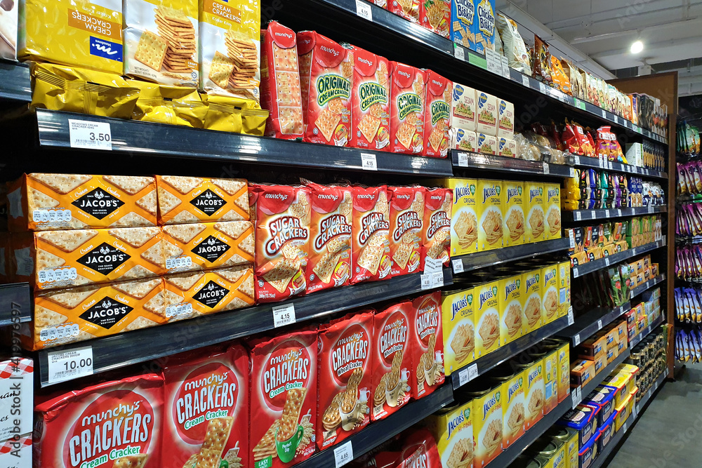Various brands of local and imported biscuit and cream wafers on store ...