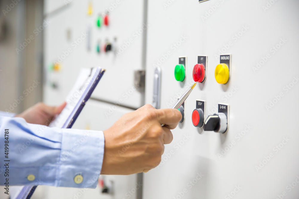 Electrical engineer checking electricity of air handling unit (AHU ...