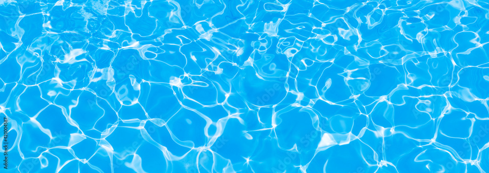 blue water surface in the swimming pool, water in the pool . horizontal ...