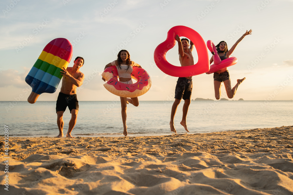 Holiday summer party with friends on the beach .Group of family and ...