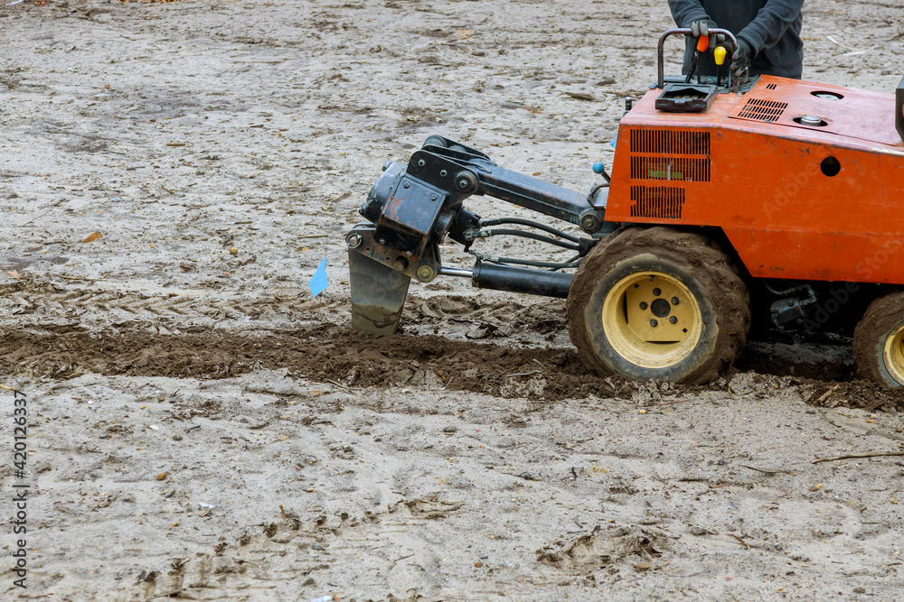 Tractor used for pipeline earthworks a digging a ground earth with ...