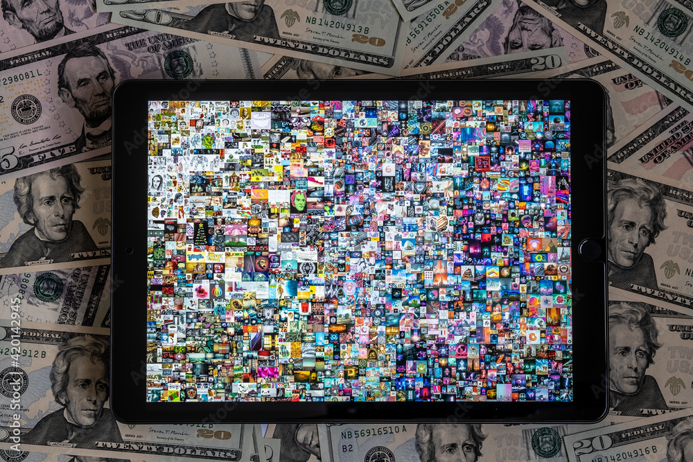 Tablet with Beeple pattern " EVERYDAYS: THE FIRST 5000 DAYS" placed on ...