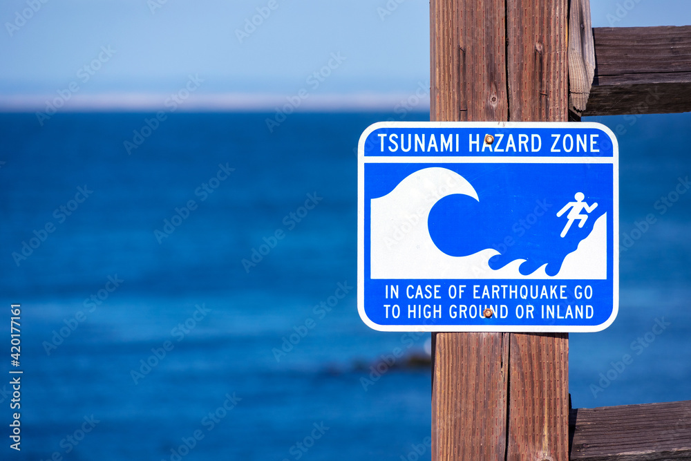 Tsunami Hazard Zone warning sign on the Pacific Ocean coast warn the ...