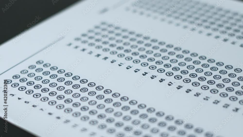 Education and exam concept. Answering multiple-choice test questions. A ...