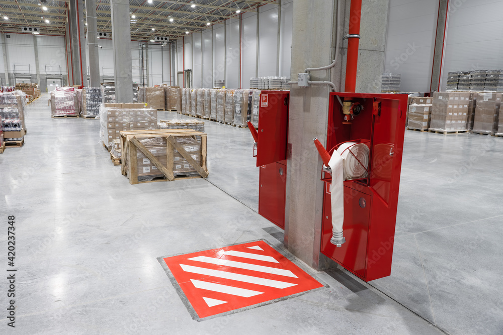 fire safety in the warehouse. new fire hydrants. red box. fire ...