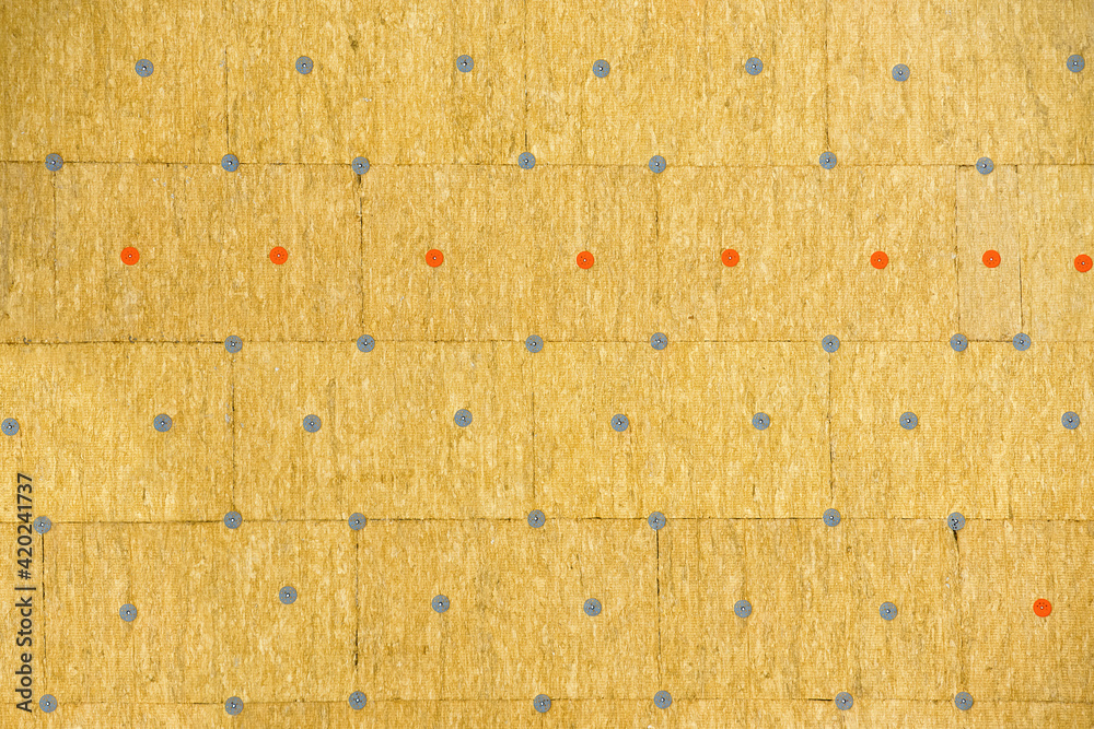 Mineral wool panels installed on wall facade of building. Thermal ...