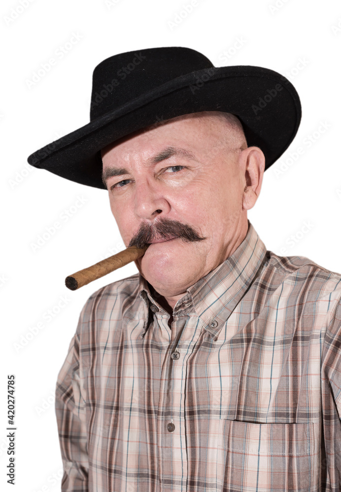 The cowboy with mustache, in a black hat smoking a cigar Stock Photo ...