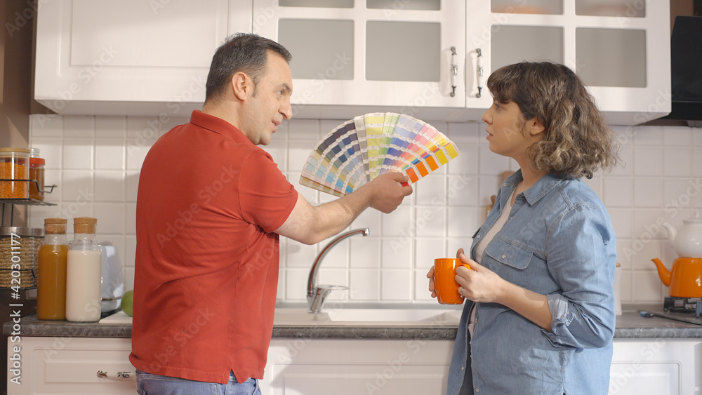 The young couple chooses colors from the color guide palette. The newly ...