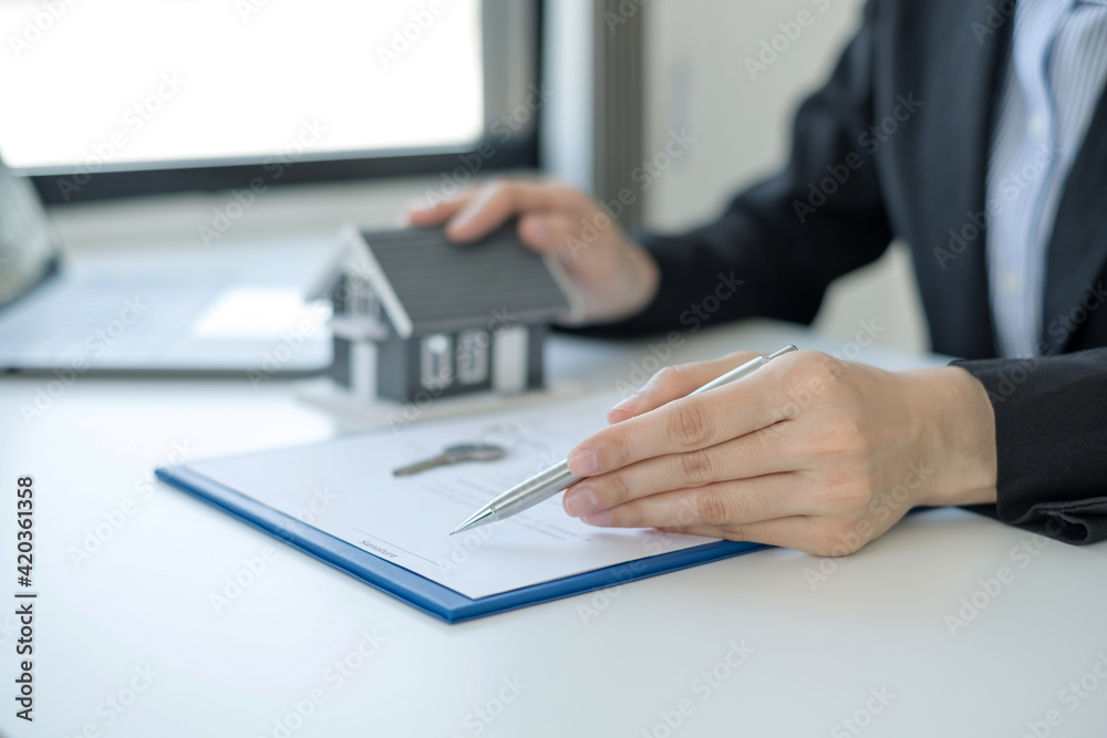 agents working in real estate investment and home insurance signing ...