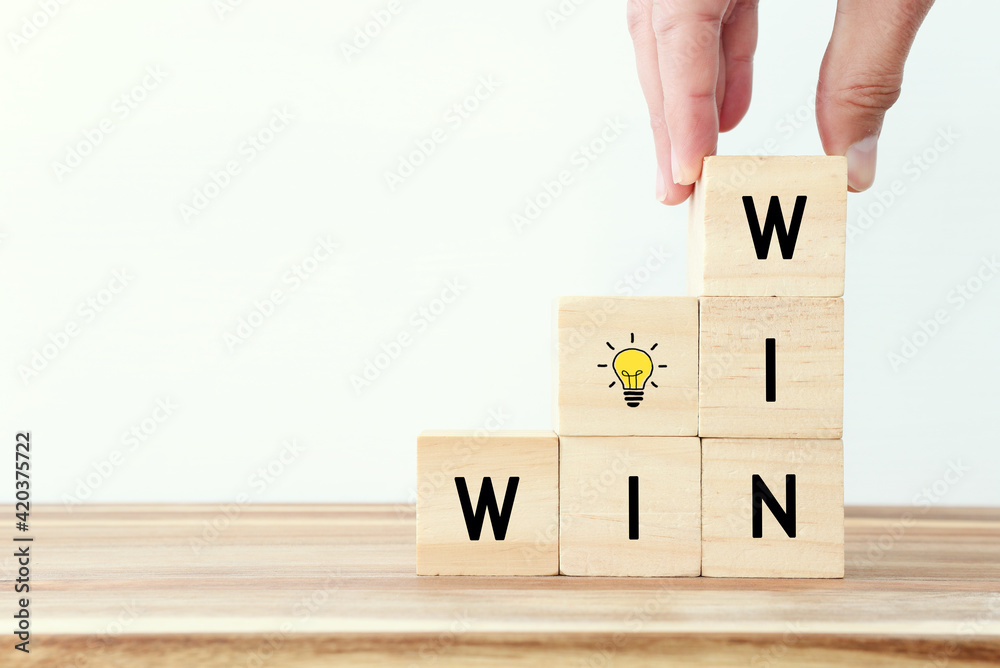 Wooden cubes stack with the text win-win-situation. Strategy and ...