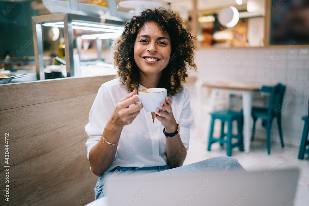 Portrait of funny female programmer in smart casual outfit smiling at ...