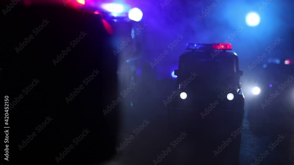 Action movie concept. Police cars and miniature movie set on dark toned ...