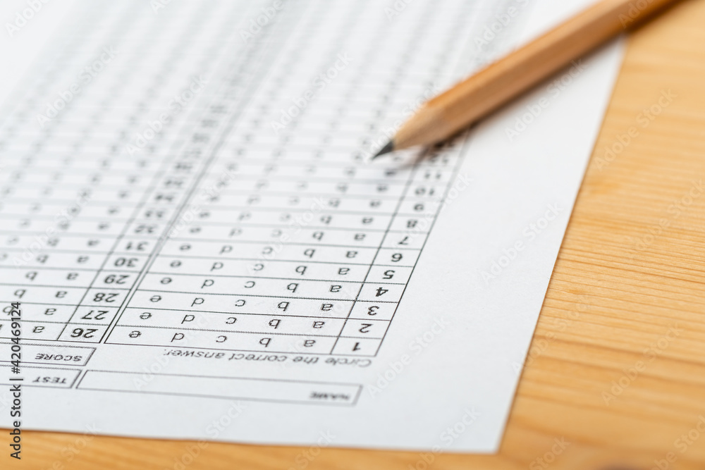 testing in exercise and exam paper. computer sheet with pencil in ...