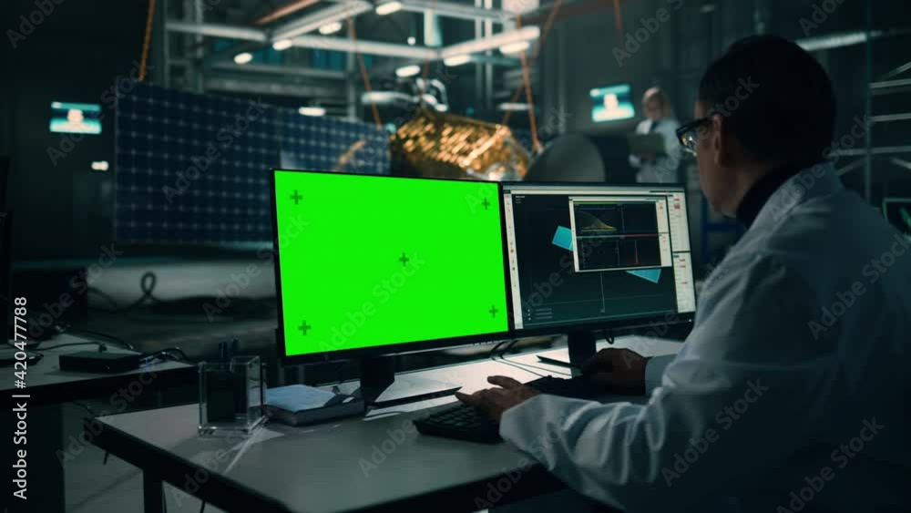 Male Engineer Uses Green Screen Mock Up Display Computer to Analyse ...