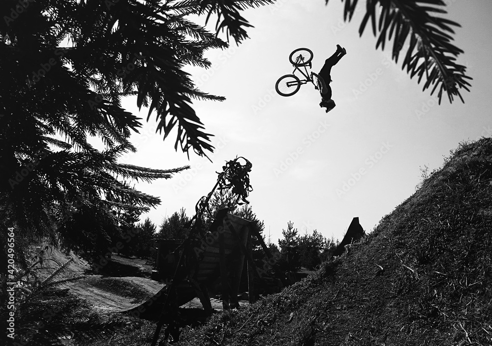 Backflip superman on a bike Stock Photo | Adobe Stock