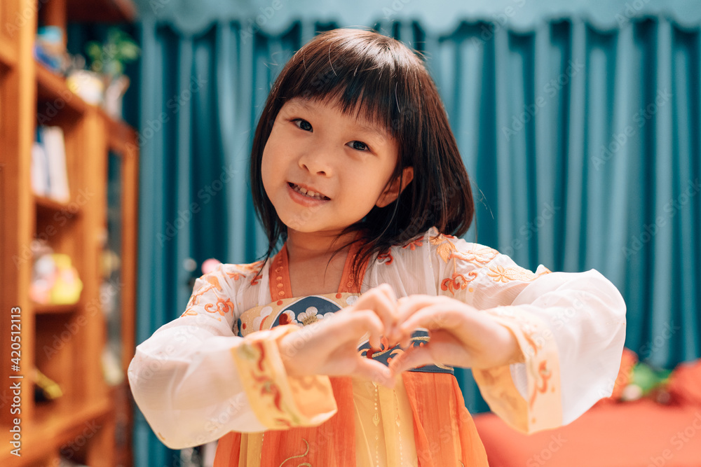 Little girl wearing traditional Chinese clothing at home Stock Photo ...