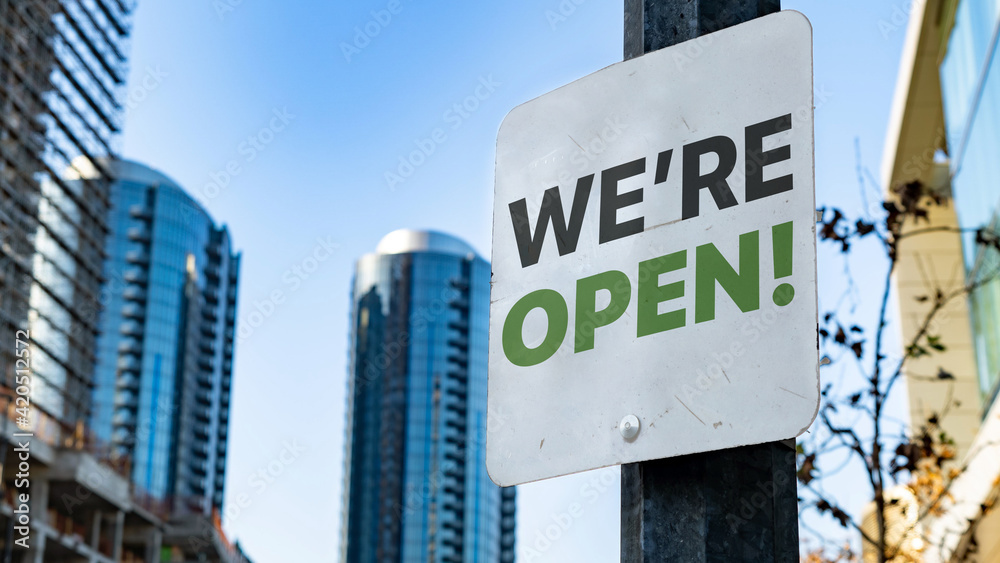 We're Open Worn Sign in Downtown city setting Stock Photo | Adobe Stock