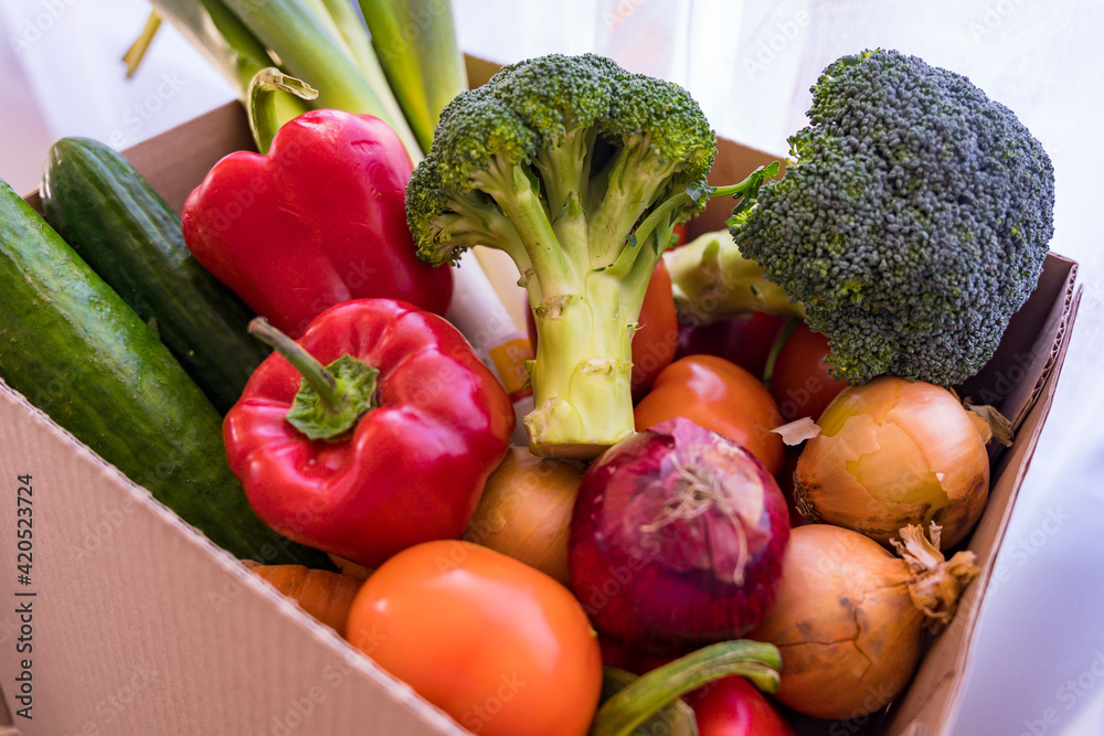 Set of different fresh vegetables in a cardboard box. Home delivery of ...