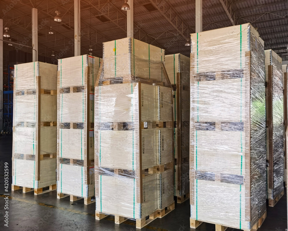 Shipment cartons box on pallets and wooden case on hand lift in ...