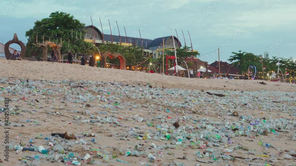 Vidéo Stock Sand beach Bali littered with plastic waste. Indonesia is ...