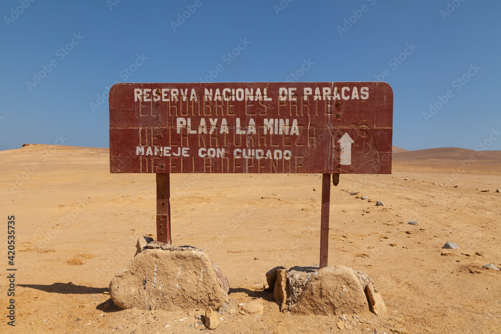 Old visitor information sign, in the middle of the Paracas desert, near ...