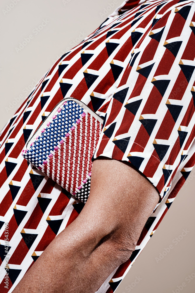 man carrying his wallet under his arm Stock Photo | Adobe Stock