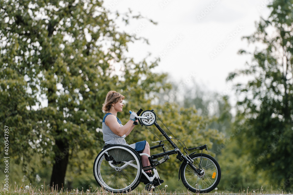 Content woman riding tricycle for people with special needs Stock Photo ...