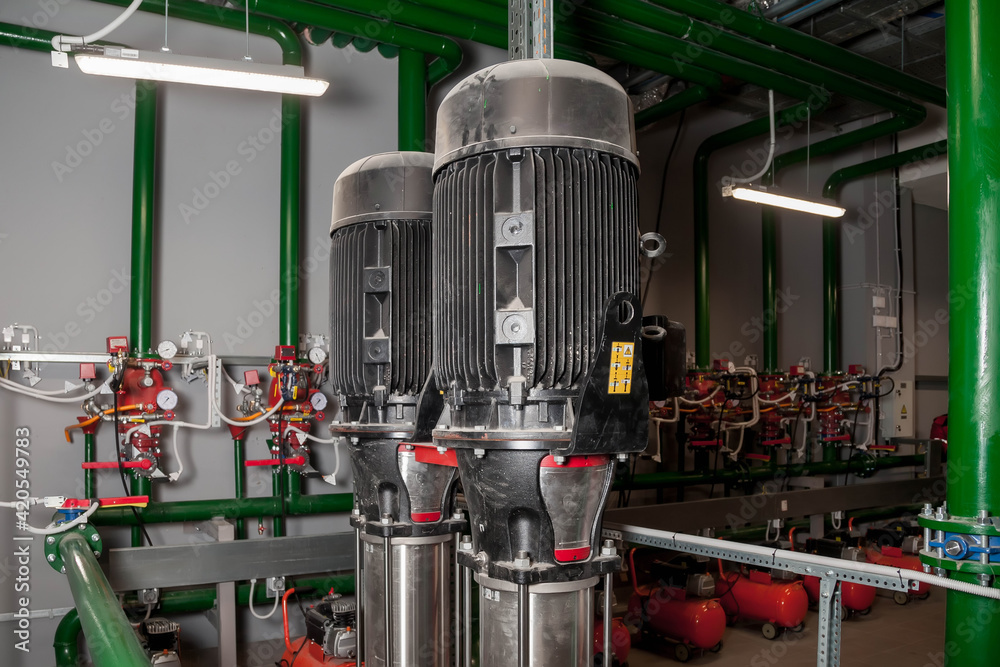 Water pump station and pipeline with tanks in an industrial room to ...