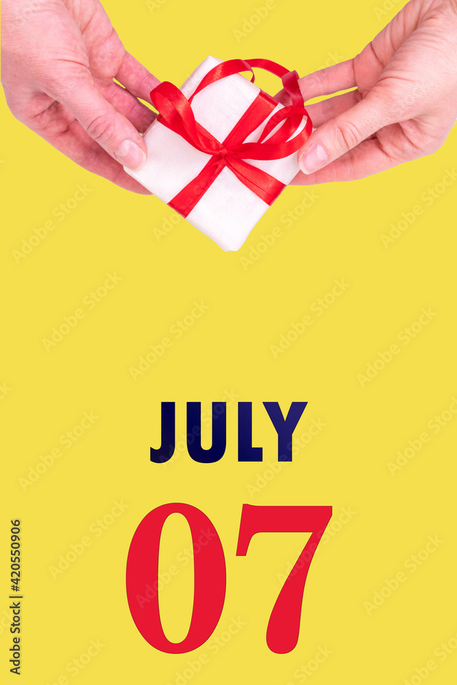 July 7th. Festive Vertical Calendar With Hands Holding White Gift Box ...