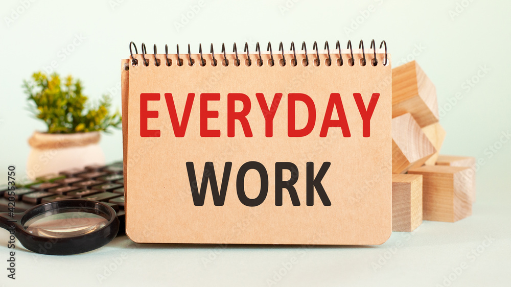 Business concept. Notebook with text everyday work sheet of white paper ...