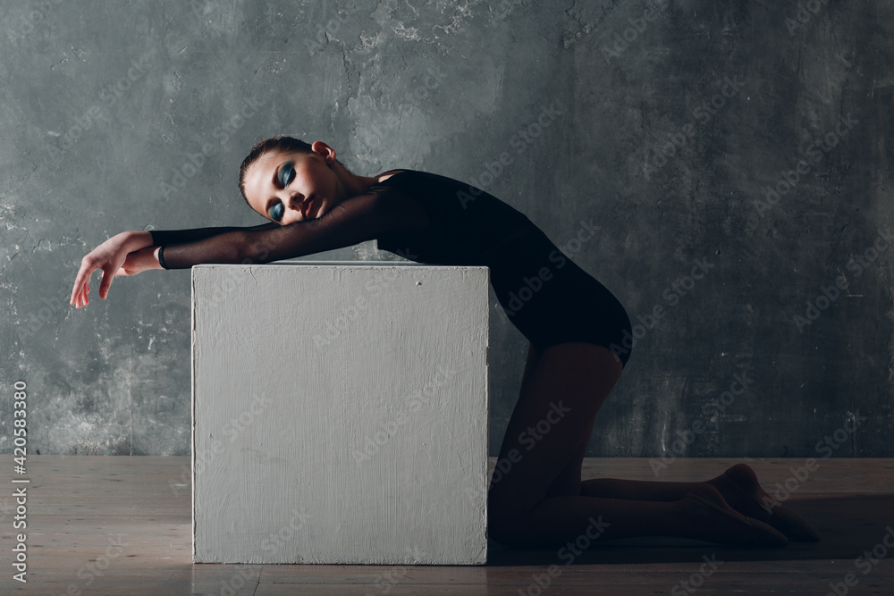Young girl professional gymnast woman rhythmic gymnastics relaxing with ...
