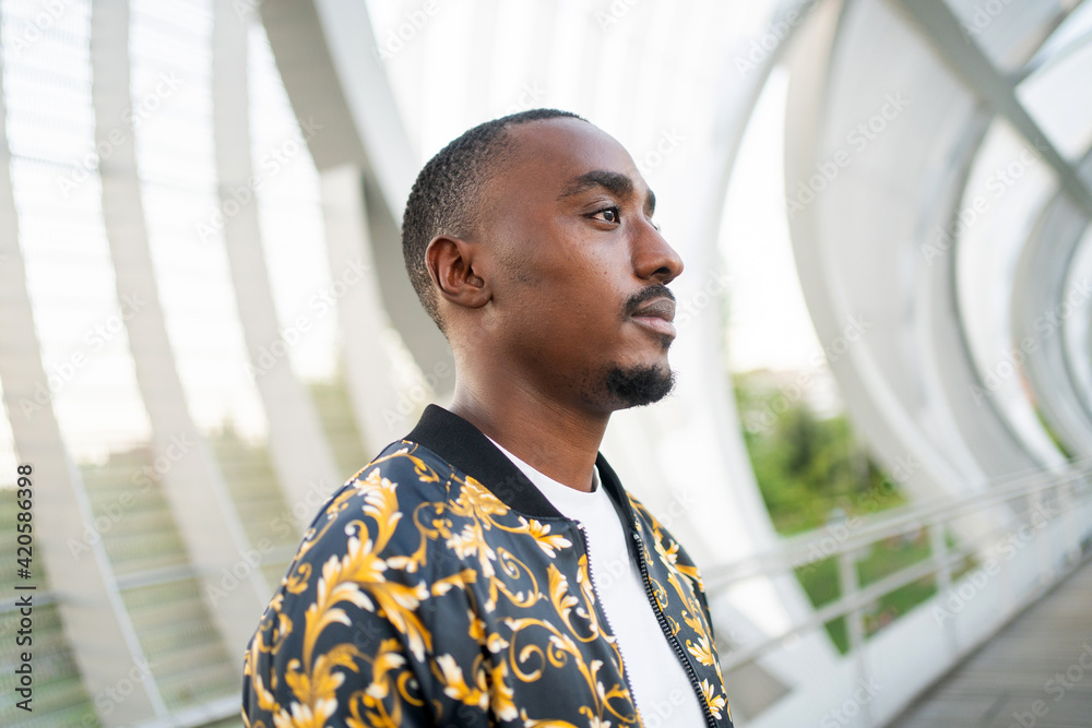 Profile Of A Young Black Man Outdoors. Stock Photo | Adobe Stock