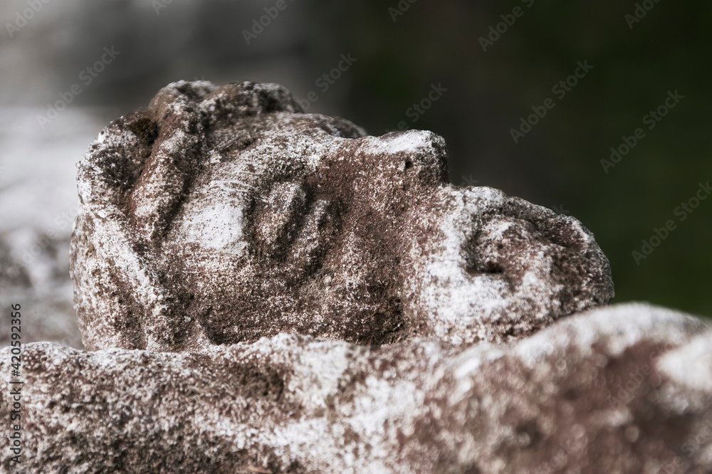 Fragment of destroyed ancient stone sculpture of Jesus Christ ...