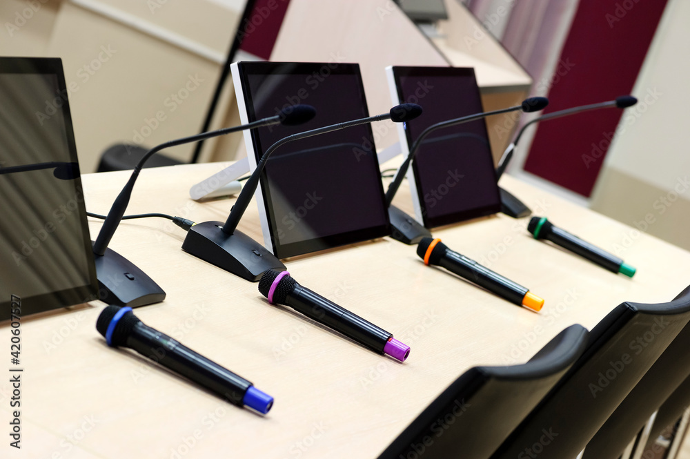 Conference room ready for business meeting, table with microphones and ...