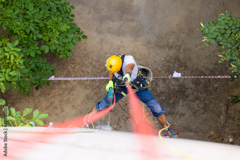 Working at elevations. Rope access, high-altitude outdoor work. Stock ...