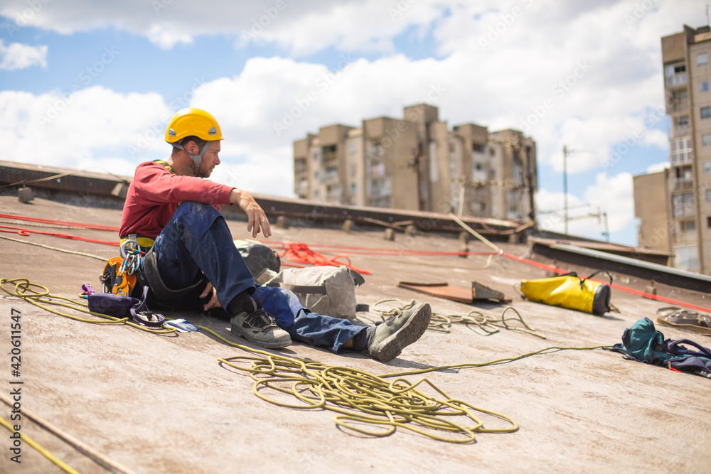 Working at elevations. Rope access, high-altitude outdoor work. Stock ...