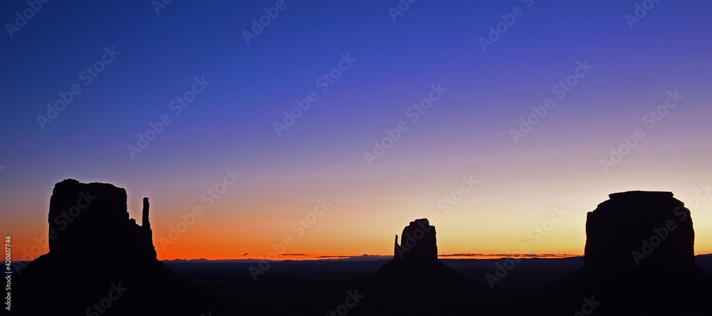 sunset in winter behind the spectacular mitten buttes and merrick butte ...