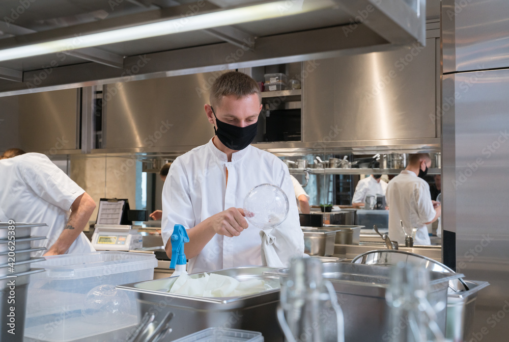 Assistant Chef Cleaning Dishes Stock Photo | Adobe Stock