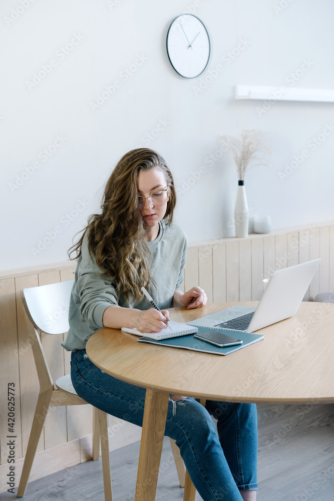 Modern smart woman studying with gadgets Stock Photo | Adobe Stock