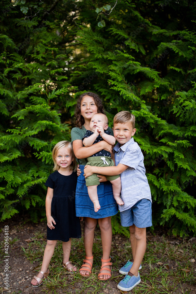 Four Young Siblings Stock Photo | Adobe Stock