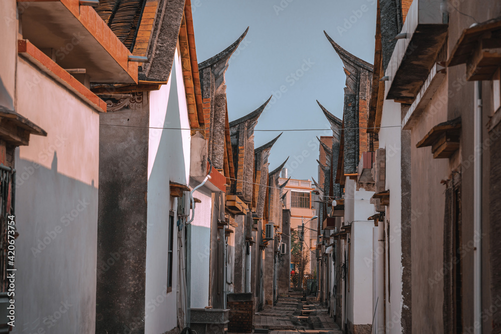 Narrow street among the ancient Chinese village buildings, an ...