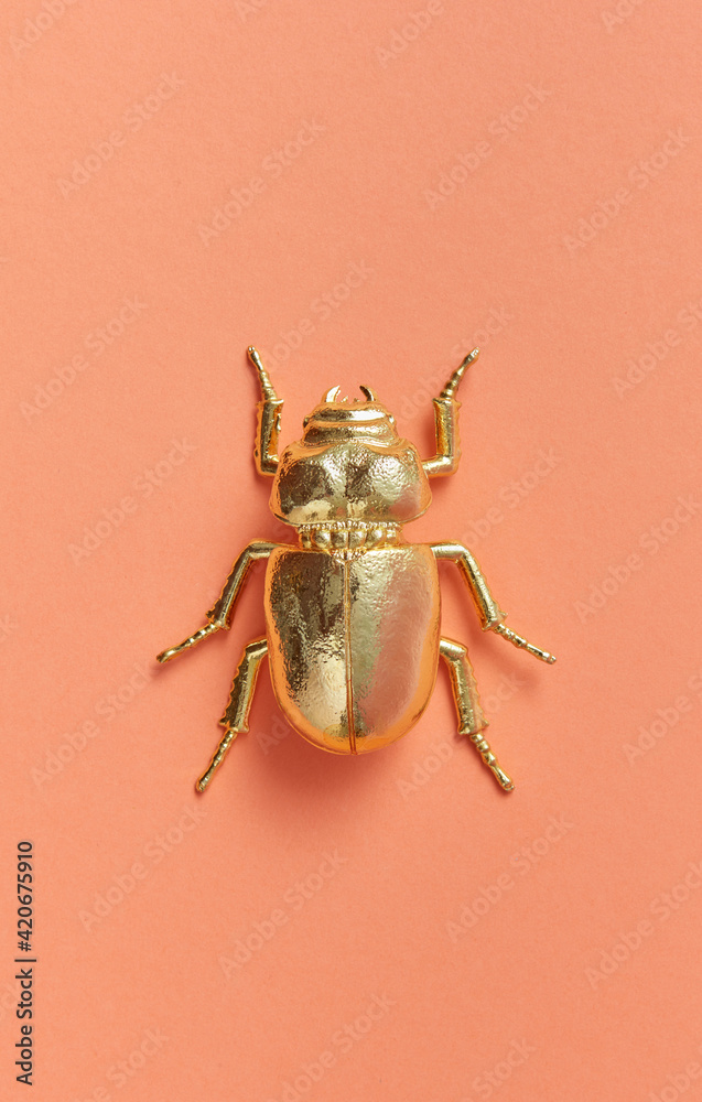 Golden scarab beetle made from gold metal. Stock Photo | Adobe Stock