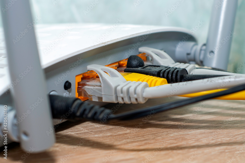 electrical wires connected to the back of the modem Stock Photo | Adobe ...