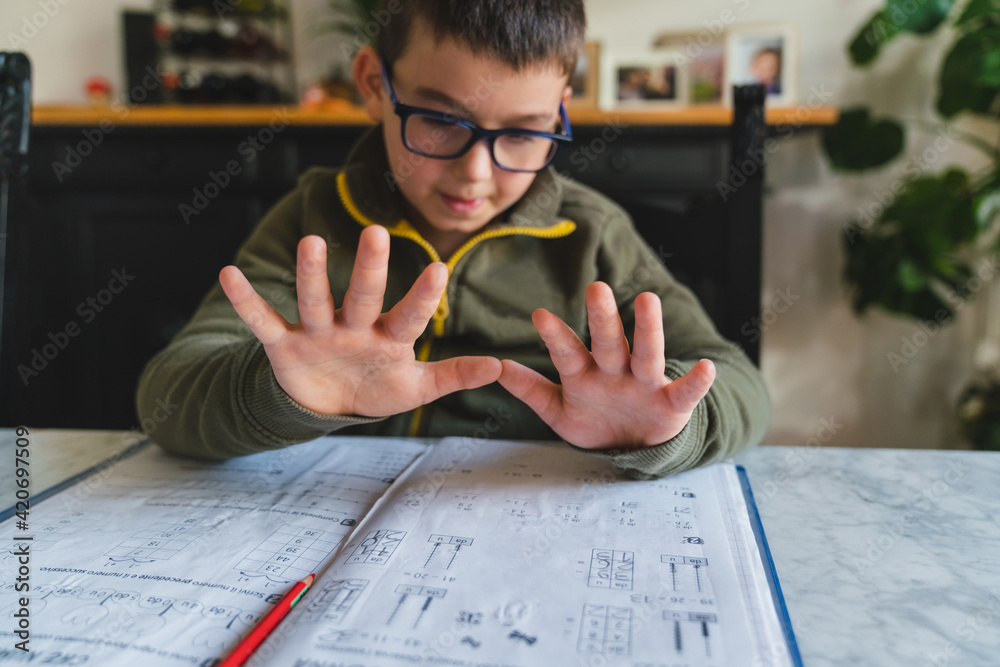 Kid Counting for Homework Stock Photo | Adobe Stock