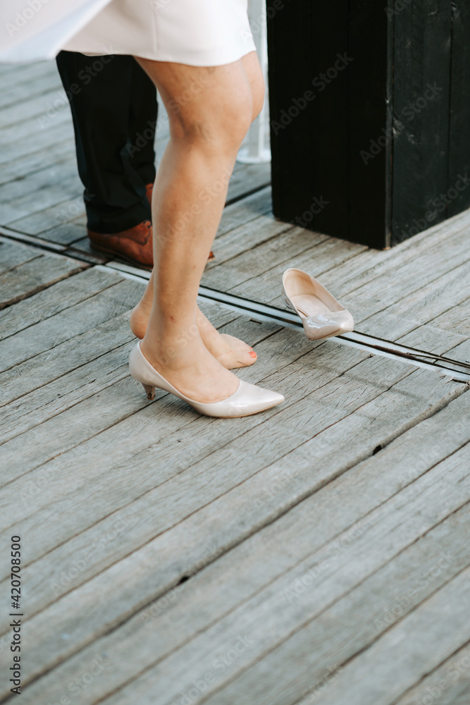 elder woman with stockings got stuck with high heel Stock Photo | Adobe ...