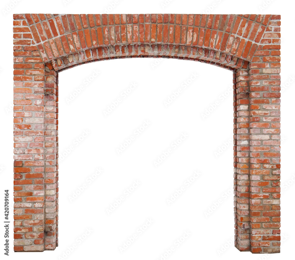 The arch for the gate of the village barn is made of red bricks ...