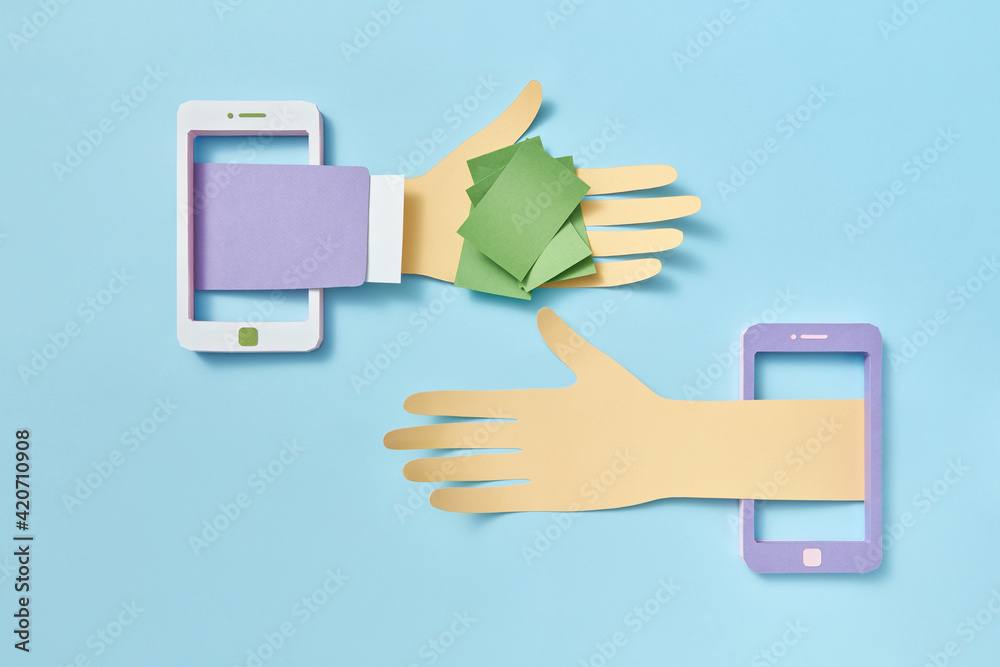 Two papercraft hands with green paper sheets on one. Stock Photo ...