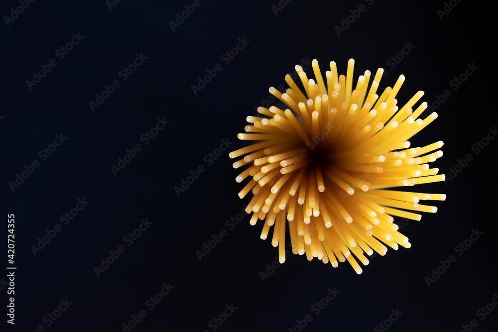 Raw dry spaghetti italian pasta yellow long line it looks like ...